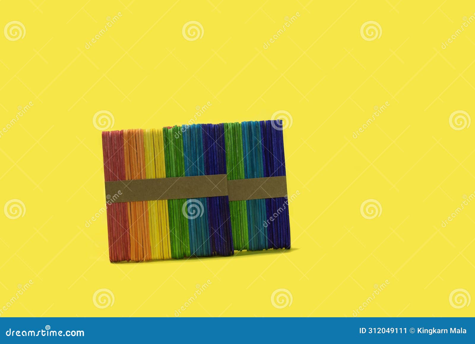 Colorful Popsicle Sticks on a Bright Yellow Background Ready To Work on ...