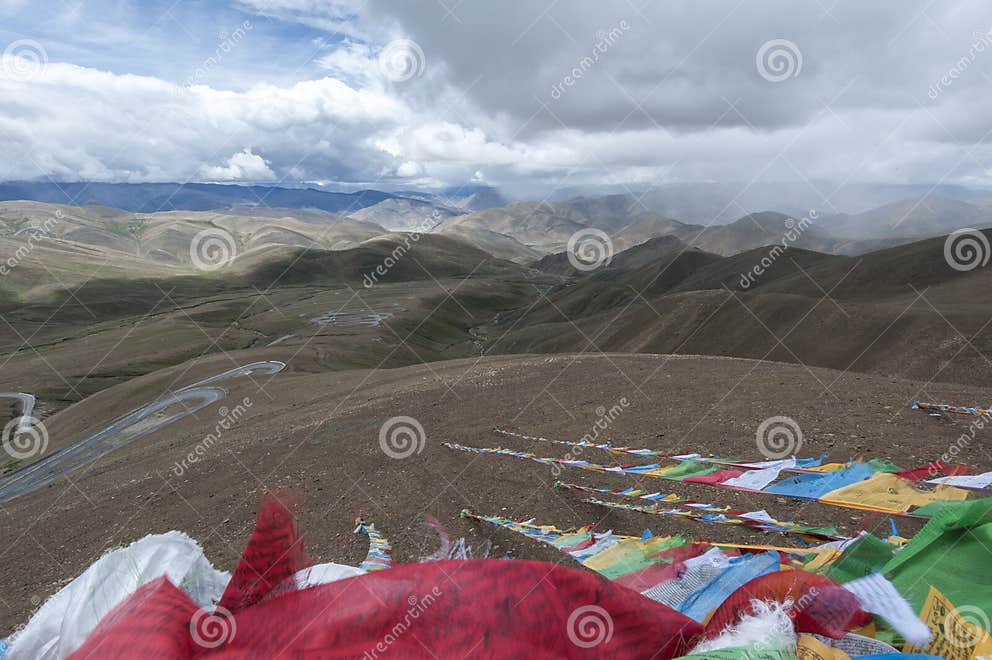 Colorful Prayer Flags Flutter Above Serpentine Road Across Pang La Pass ... Colorful Prayer Flags Flutter Above Serpentine Road Across Pang La Pass ...
