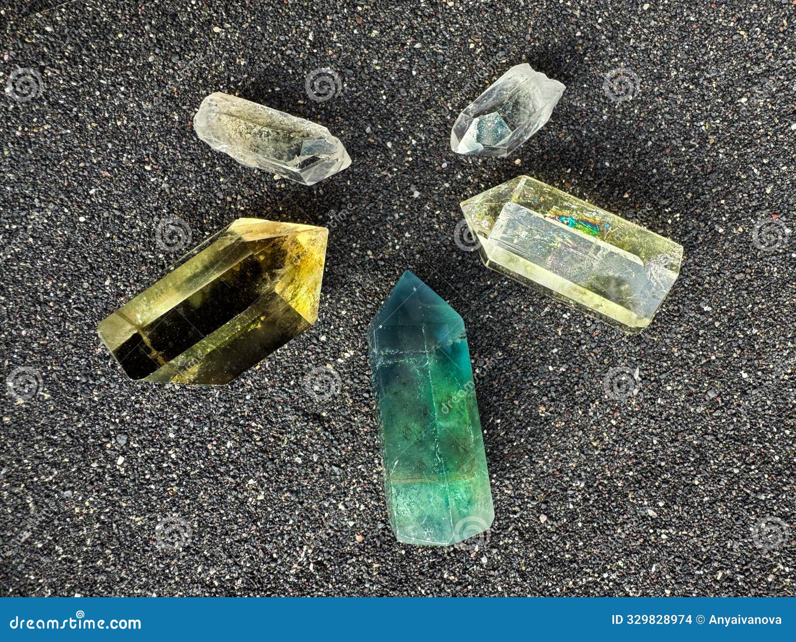 Colorful Quartz Crystals Set on Black Sand Background Stock Photo ...