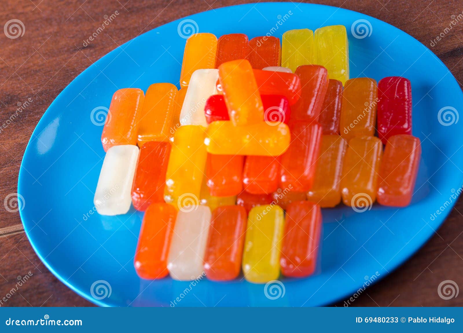 Colorful Rectangular Hard Candy Placed on Blue Plate with Wooden ...
