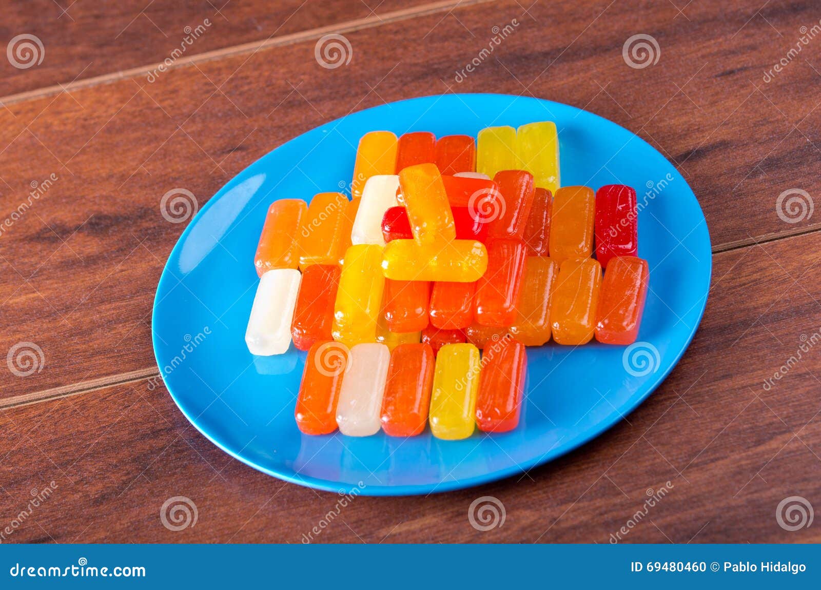 Colorful Rectangular Hard Candy Placed on Blue Plate with Wooden ...