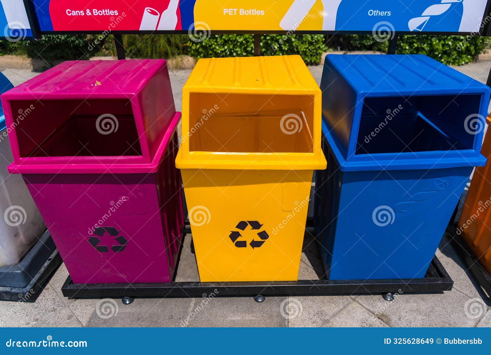 Colorful Recycling Bins in a Row for Paper, Plastic, and Trash Stock ...