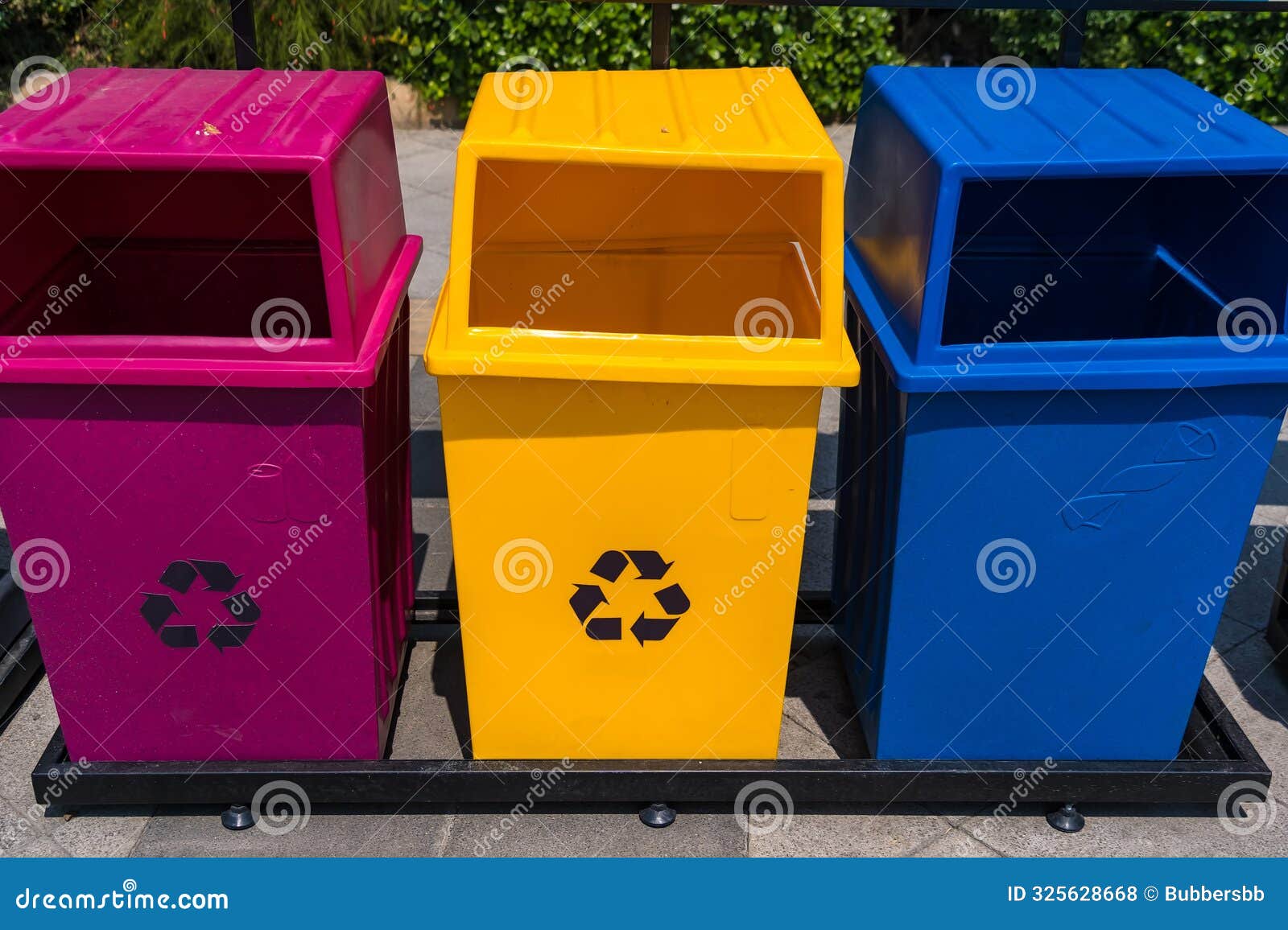 Colorful Recycling Bins in a Row for Paper, Plastic, and Trash Stock ...