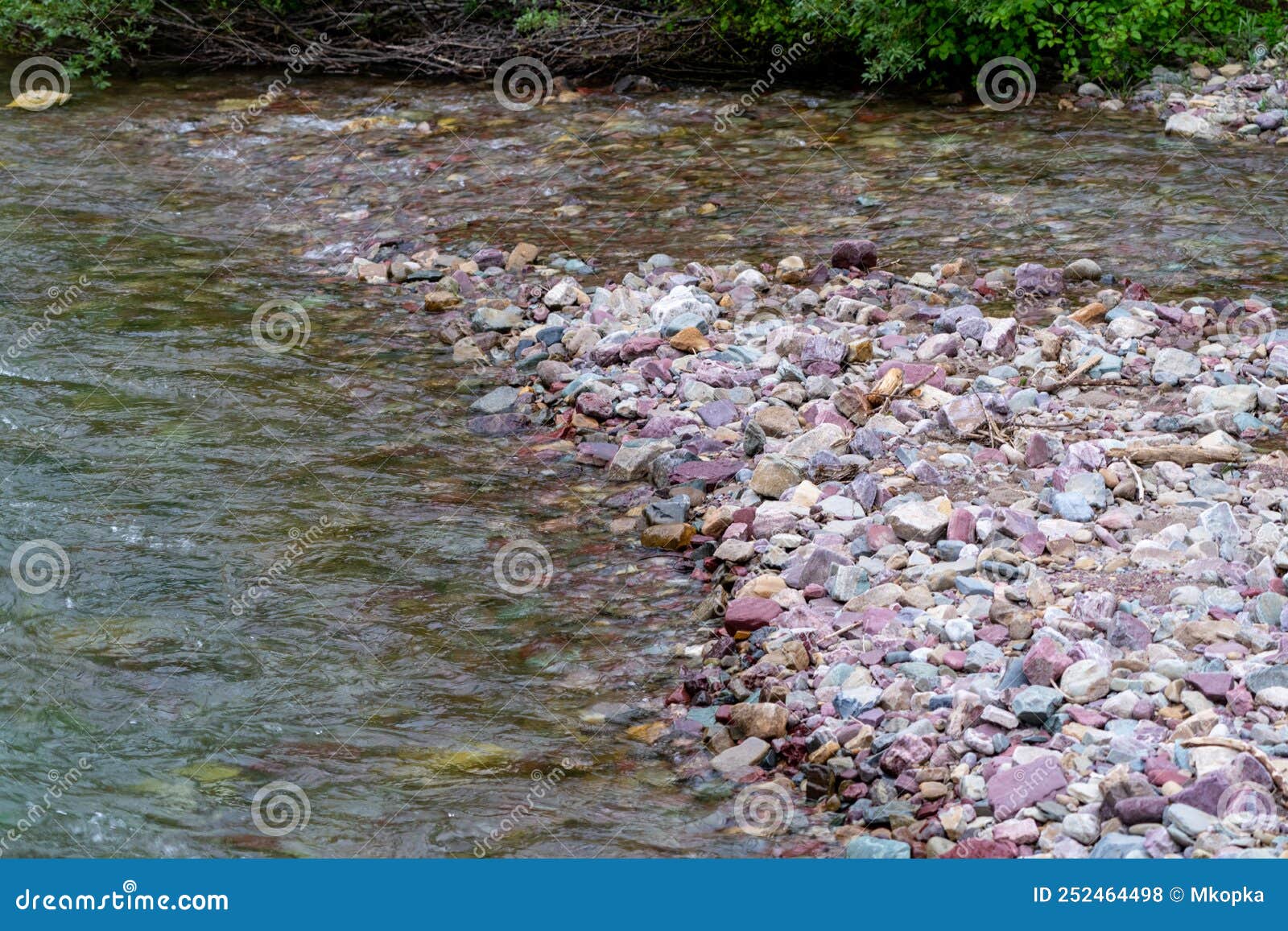 Colorful River Rocks in the River in Glacier National Park Stock Photo ...