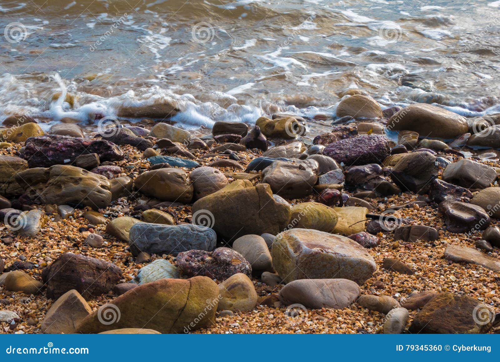 Colorful rock at beach stock photo. Image of ocean, texture - 79345360