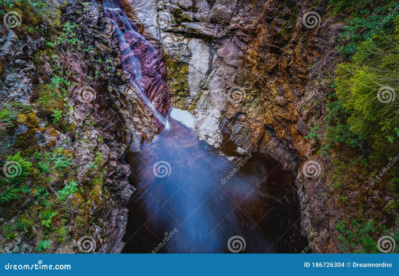 Colorful Rocks, Water Erosion, a Small Waterfall Stock Photo - Image of ...