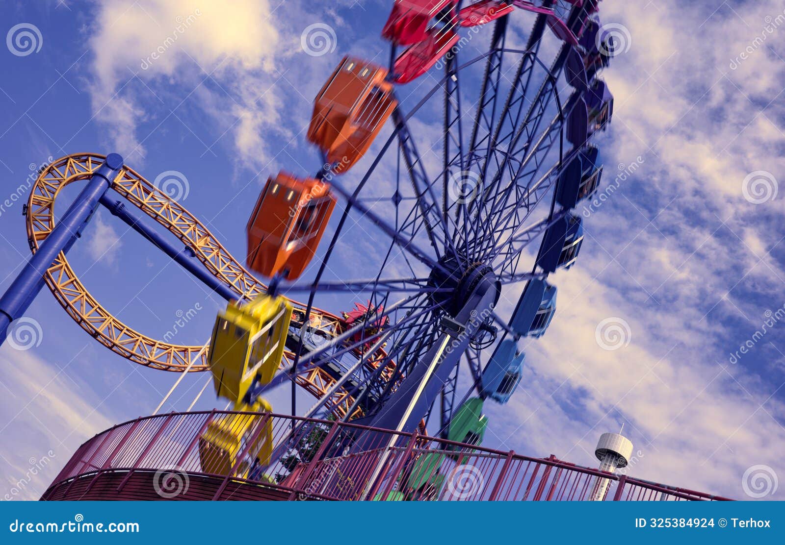 Colorful Roller Coaster and Ferris Wheel at Amusement Park Stock Photo ...