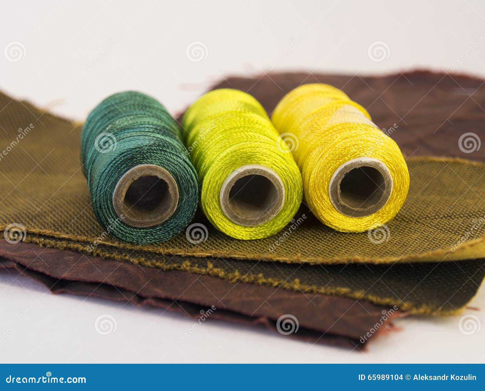 Colorful rolls of thread. stock photo. Image of isolated - 65989104