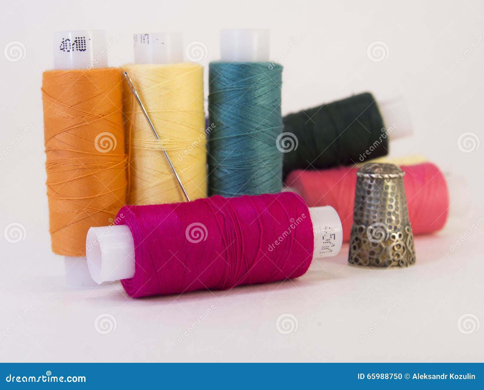 Colorful rolls of thread. stock photo. Image of pieces - 65988750