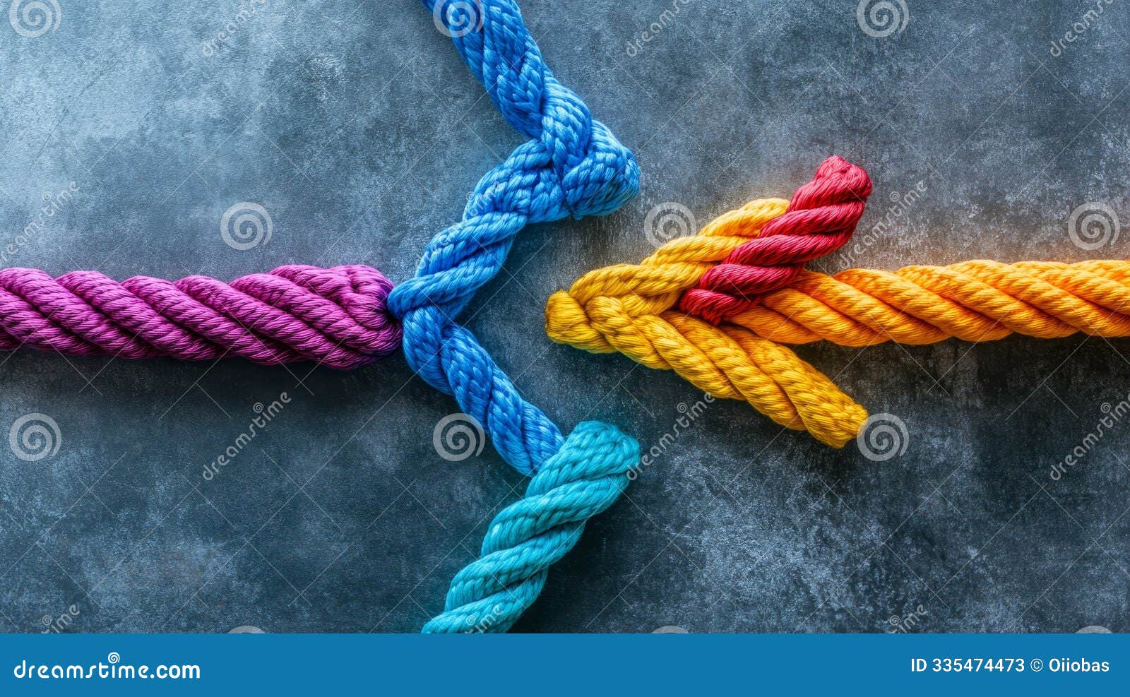 Colorful Ropes Intertwined Forming an Arrow on a Grey Background ...