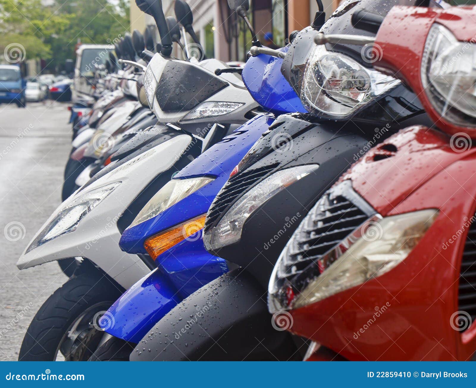 Colorful Scooters in Rain stock photo. Image of city - 22859410