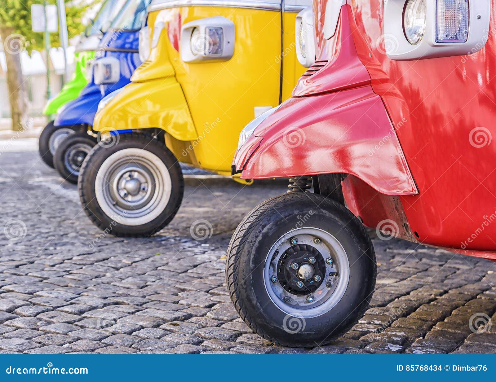 Colorful scooters in a row stock photo. Image of drive - 85768434