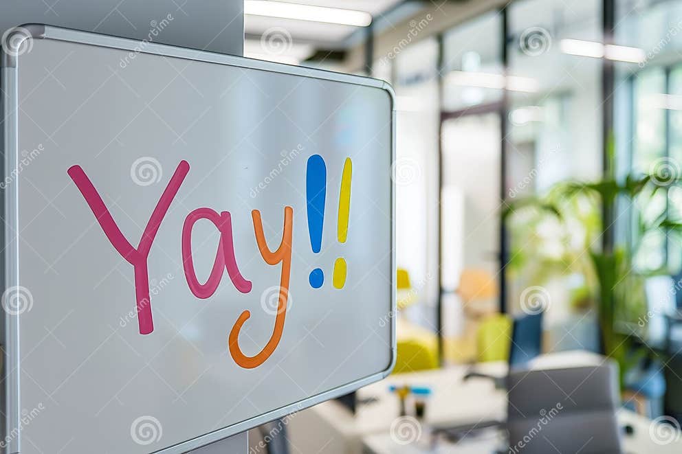 Colorful Sign with the Word Yay! in an Office Setting Stock ...