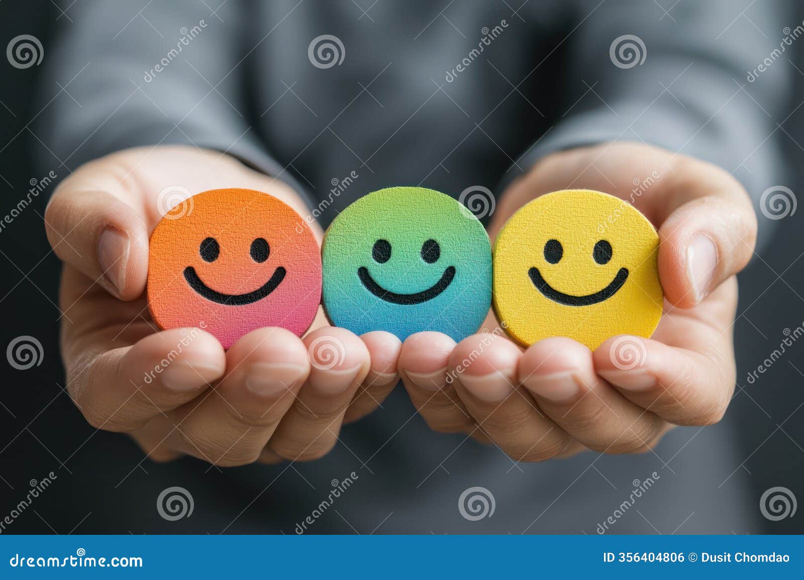 Colorful Smiley Faces in Hands Symbolize Positivity and Support Stock ...