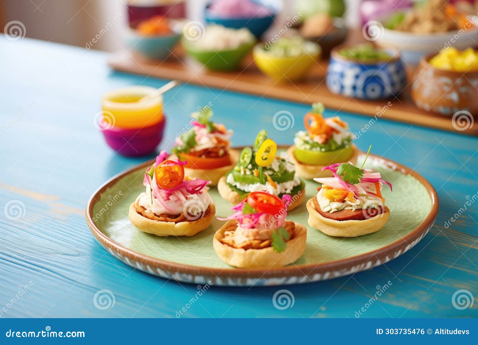 Colorful Sopes Platter with Various Toppings on Table Stock Photo ...