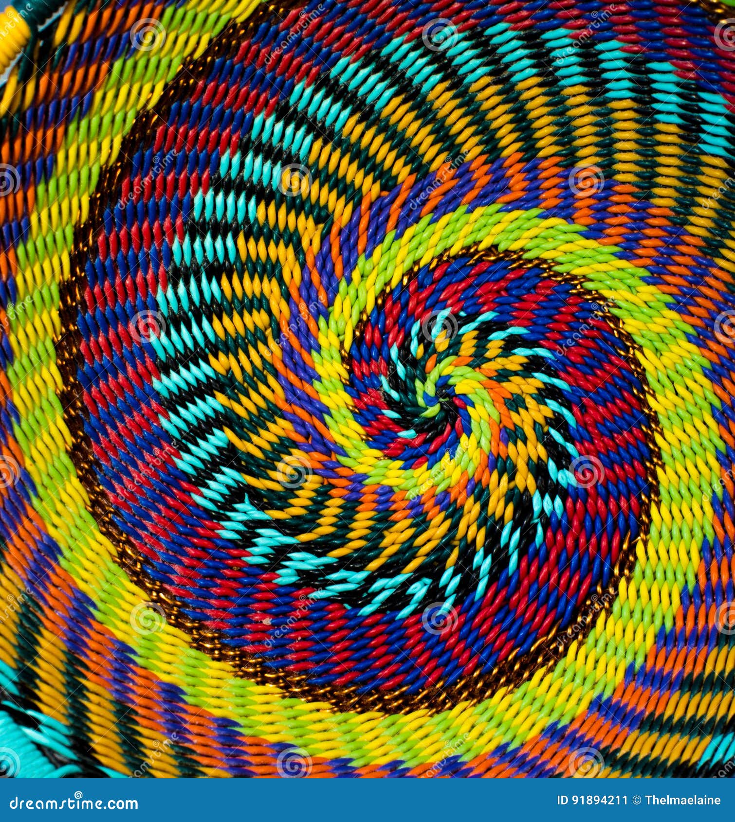 Colorful Spiral Pattern on the Bottom of a Woven Wire Basket Stock ...