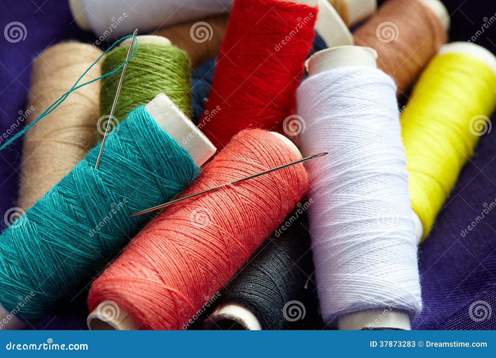 Colorful Spools Of Thread Pile With Needle Stock Image - Image of ...