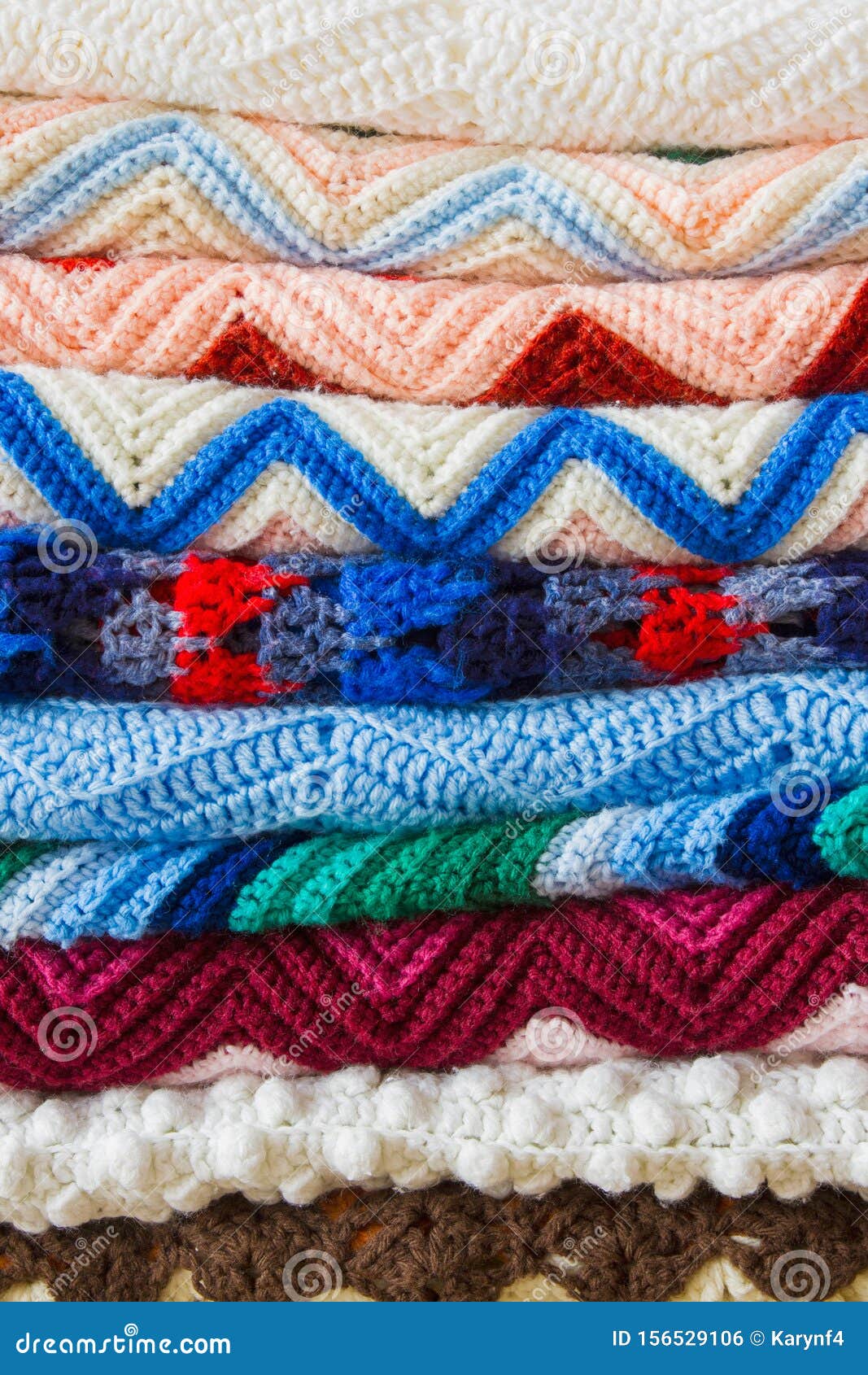 A Colorful Stack of Folded Crochet Afghans Stock Photo - Image of hard ...
