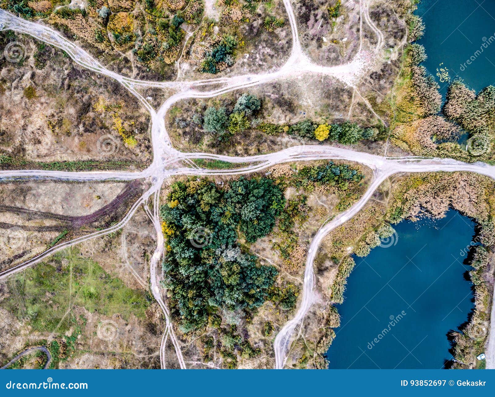 Colorful Suburb with Grove and Tracks Surrounded by Water Stock Image ...