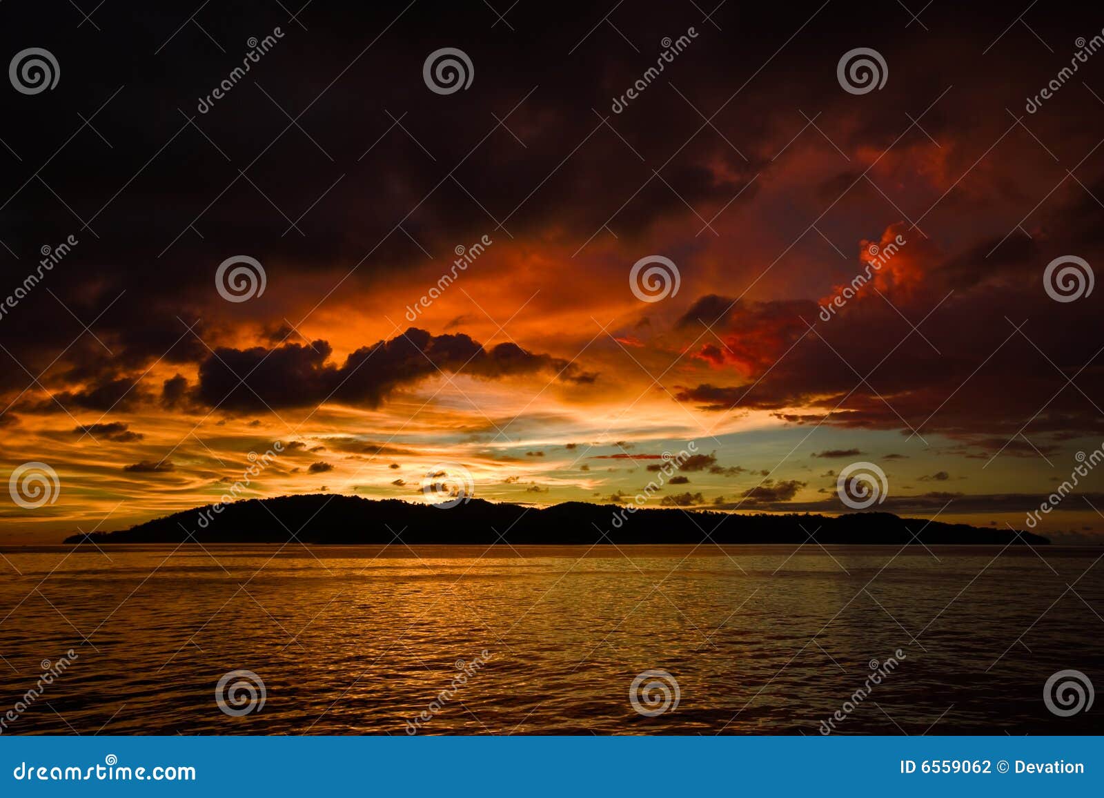 Colorful Sunset Over Rippled Water Stock Photo - Image of island ...
