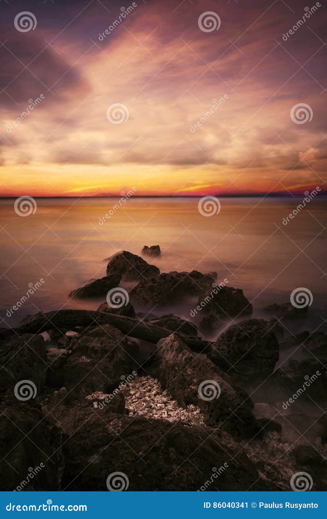 Colorful Sunset with Rocks on Beach Stock Image - Image of ocean ...