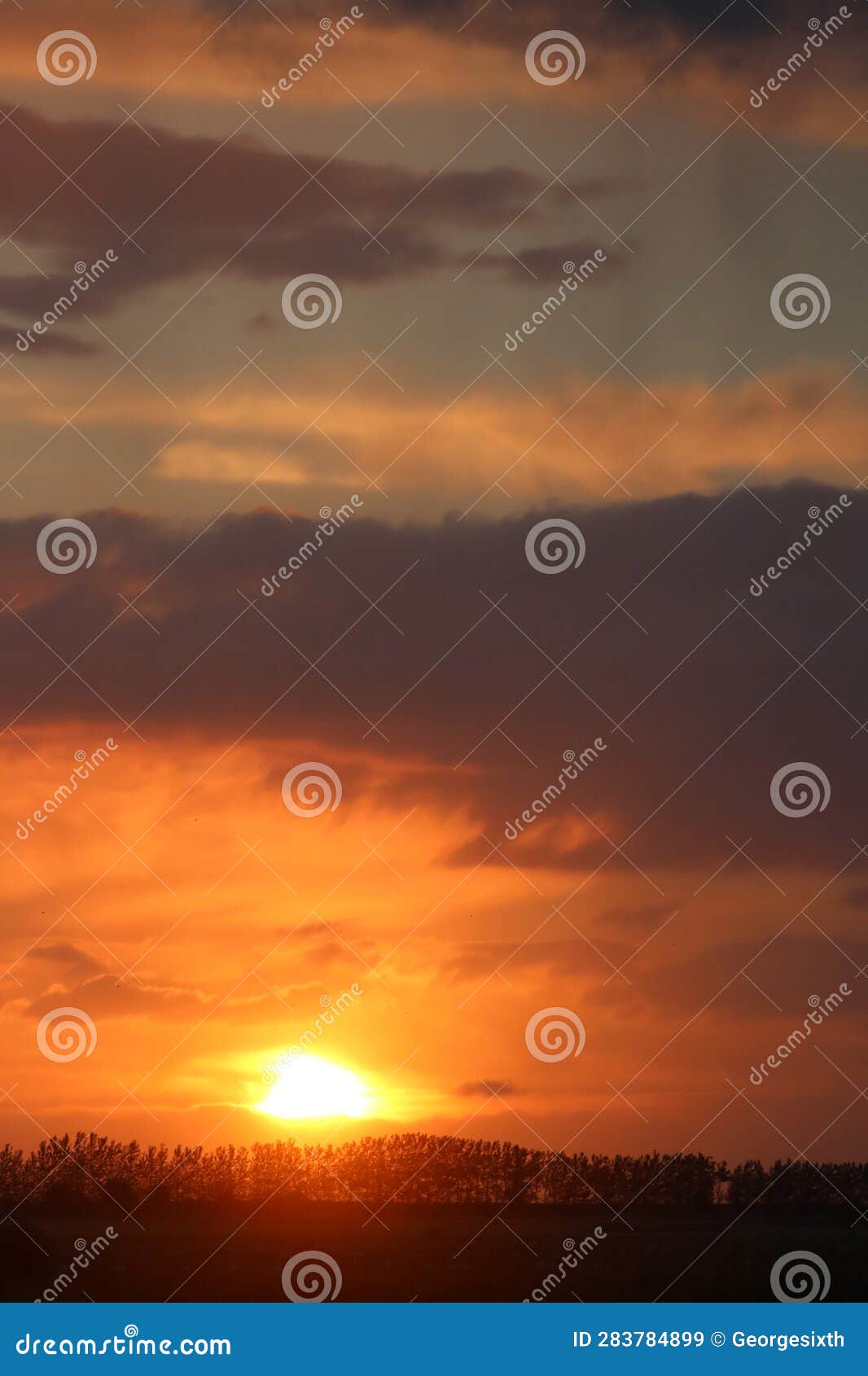Colorful Sunset Under Dramatic Clouds in Sky Stock Image - Image of portrait, sunset: 283784899