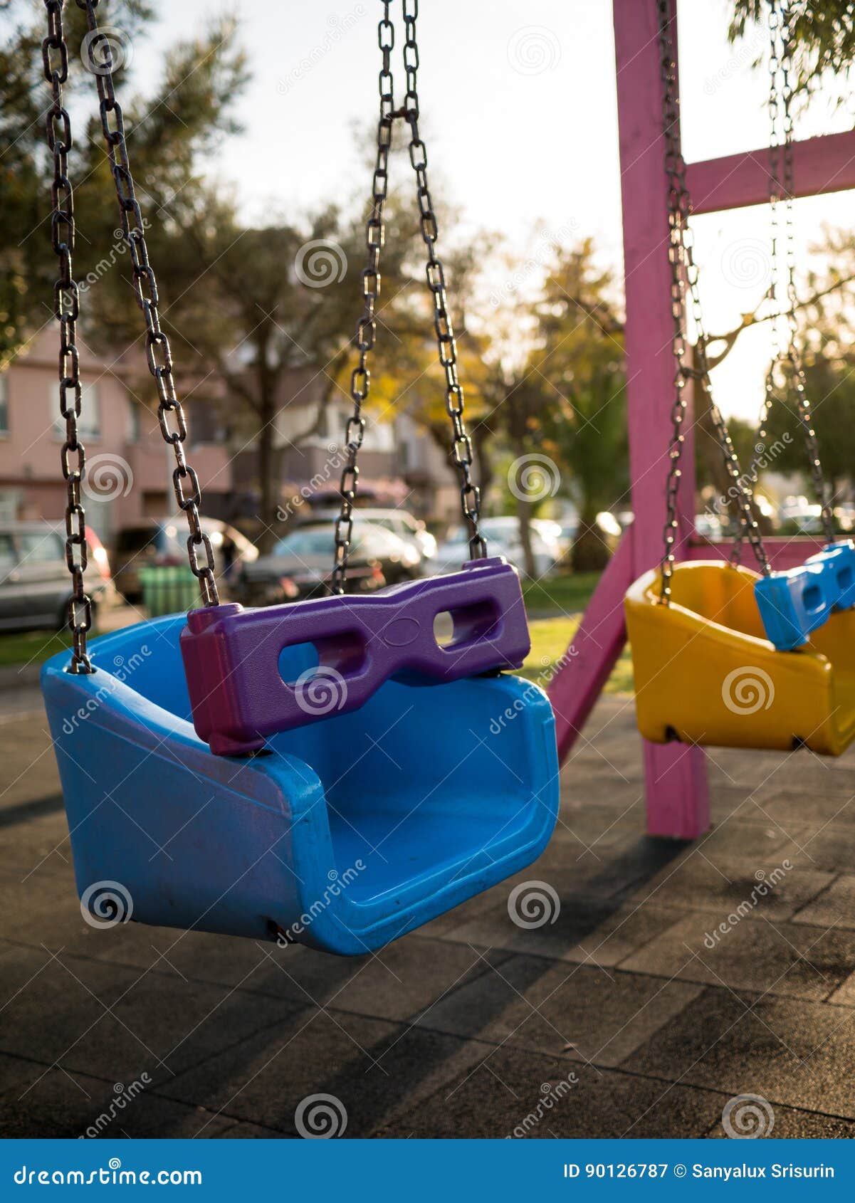 Colorful Swing Set at Playground in a Park Stock Image - Image of ...