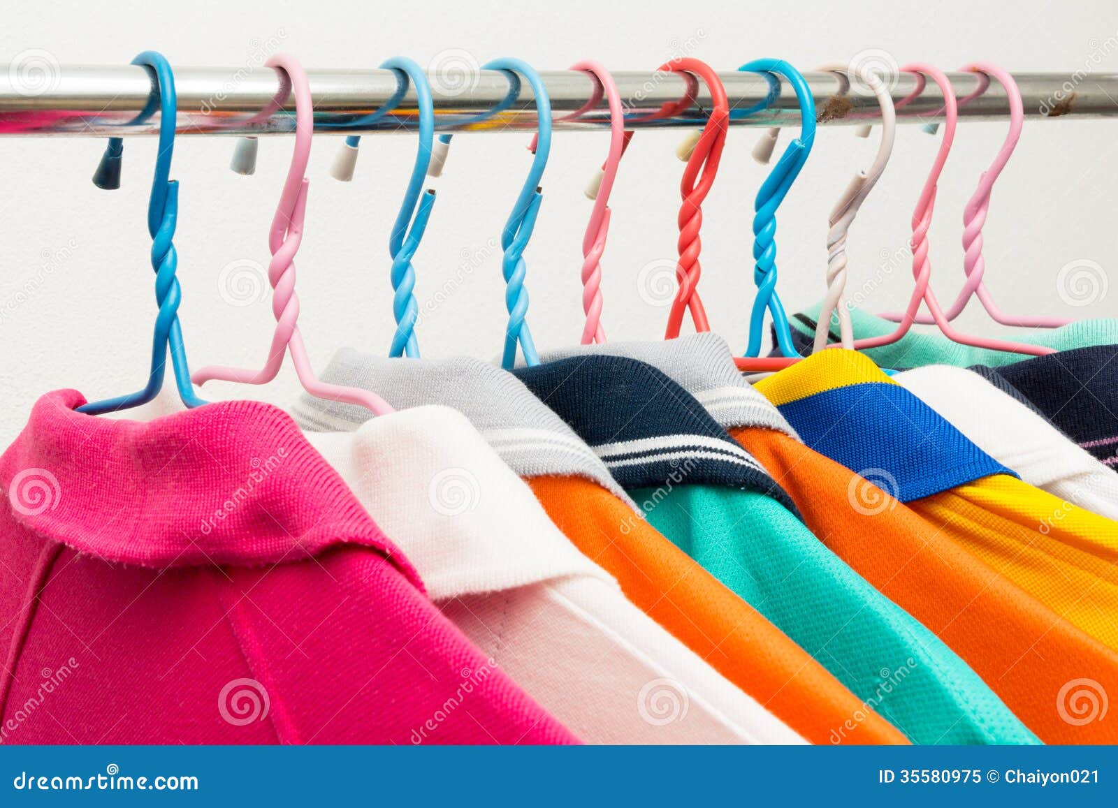 Colorful T-shirts on Hangers Stock Image - Image of bright, colors ...