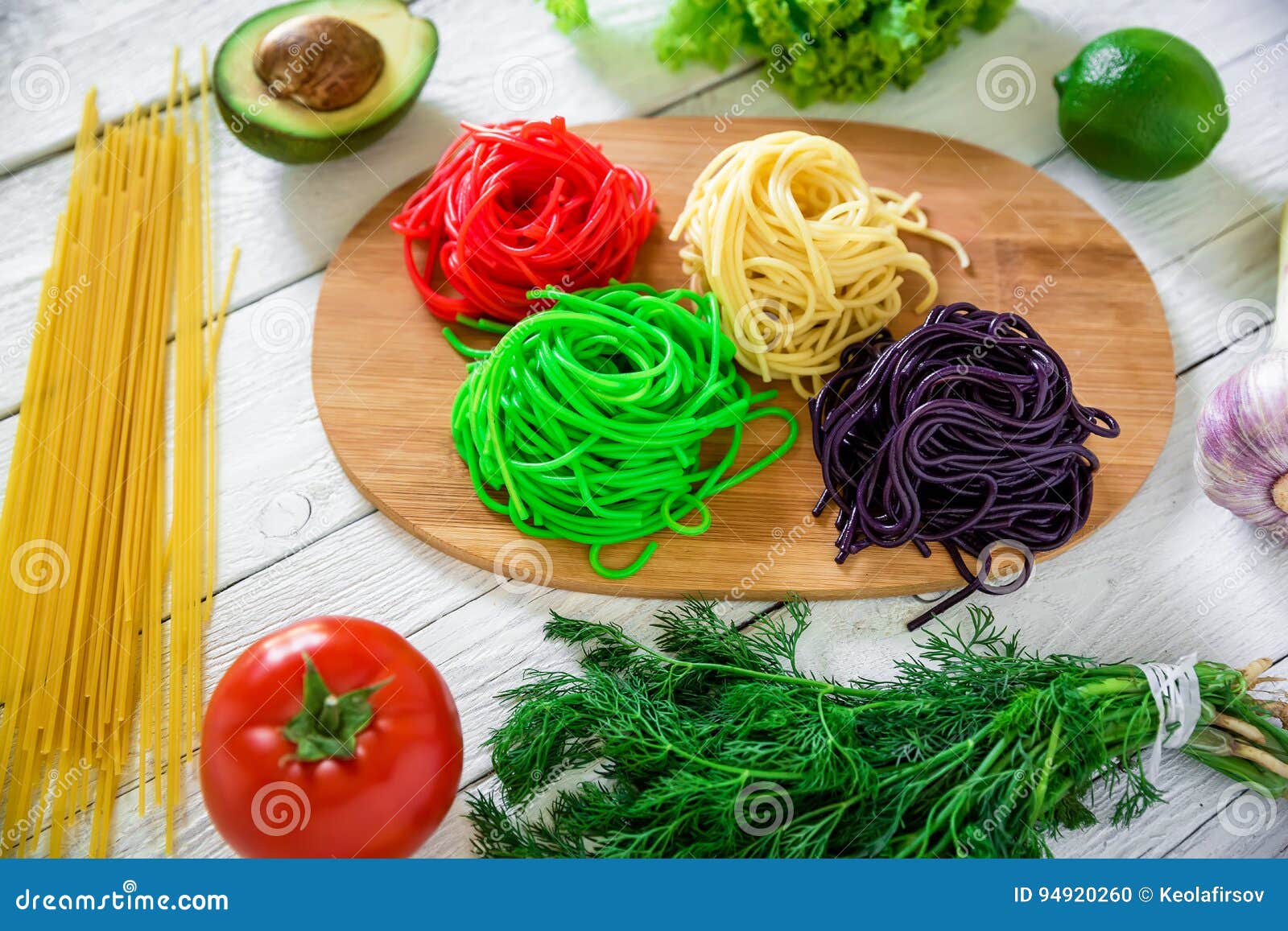 Colorful Tasty Pasta on Board and Raw Vegetables on Rustic Table. Flat ...