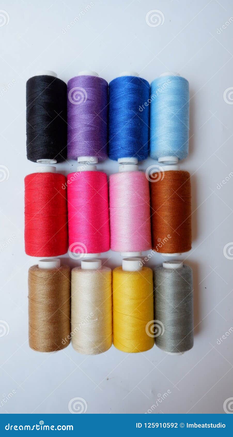 Colorful Thread Spools on a White - Image Stock Photo - Image of yarn ...