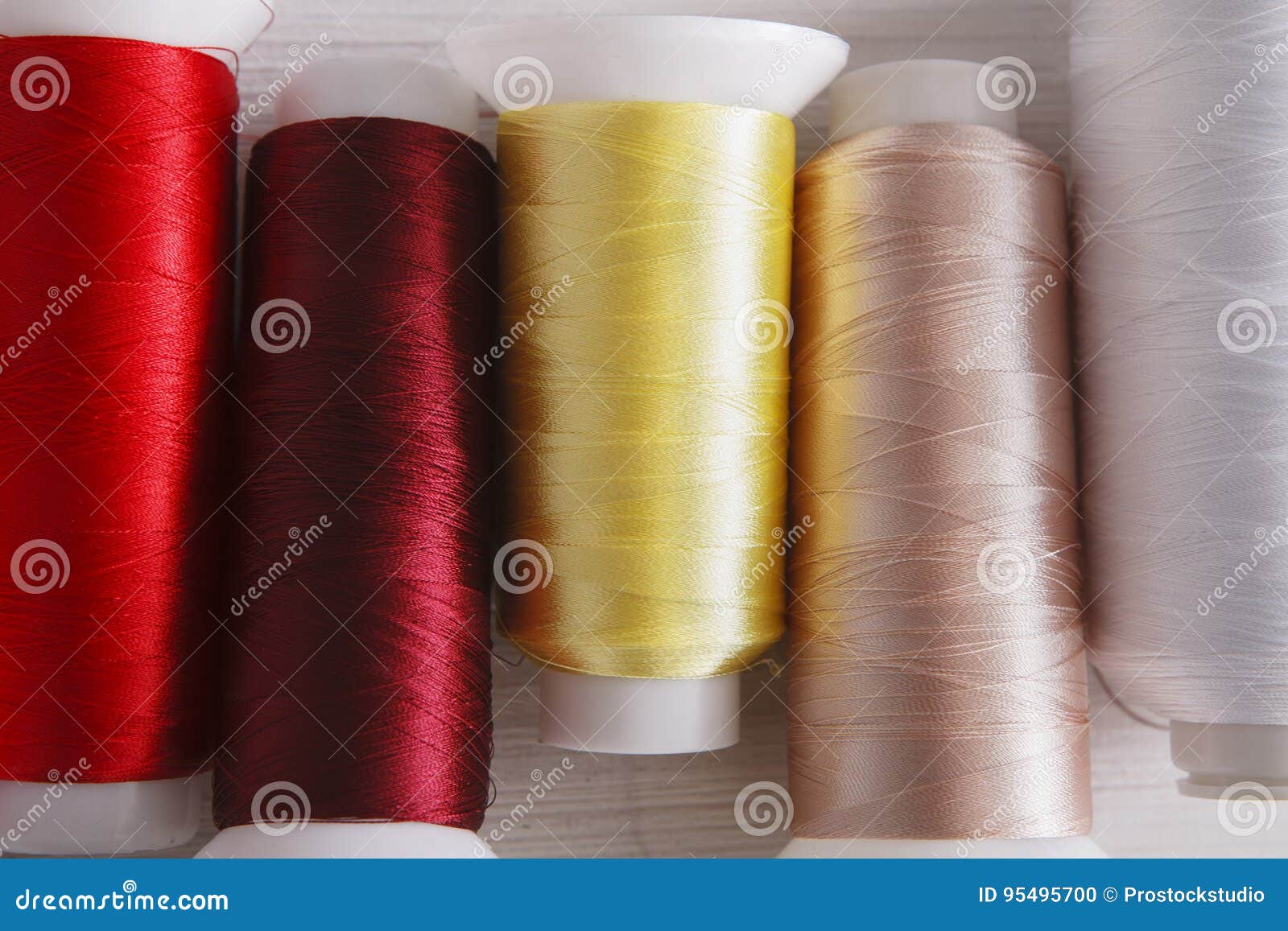 Colorful Thread Spools on Wooden Table Close Up Stock Photo - Image of ...