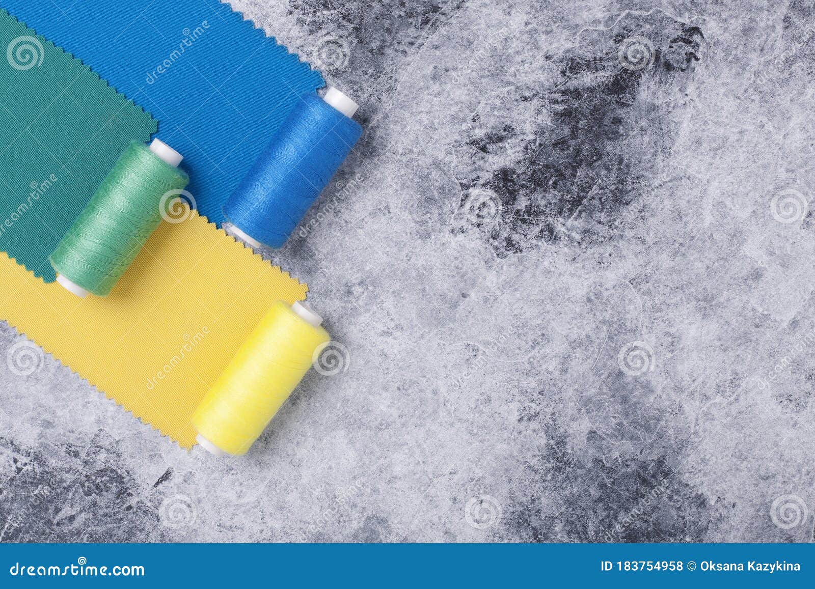 Colorful Threads Bobbins and Samples of Colored Fabrics, Sewing Kit. on ...