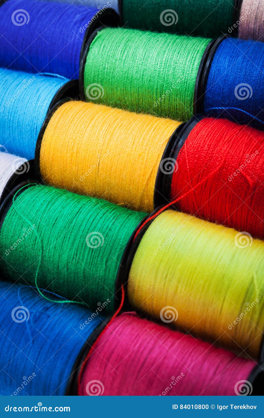 Colorful threads on spools stock photo. Image of craft - 84010800
