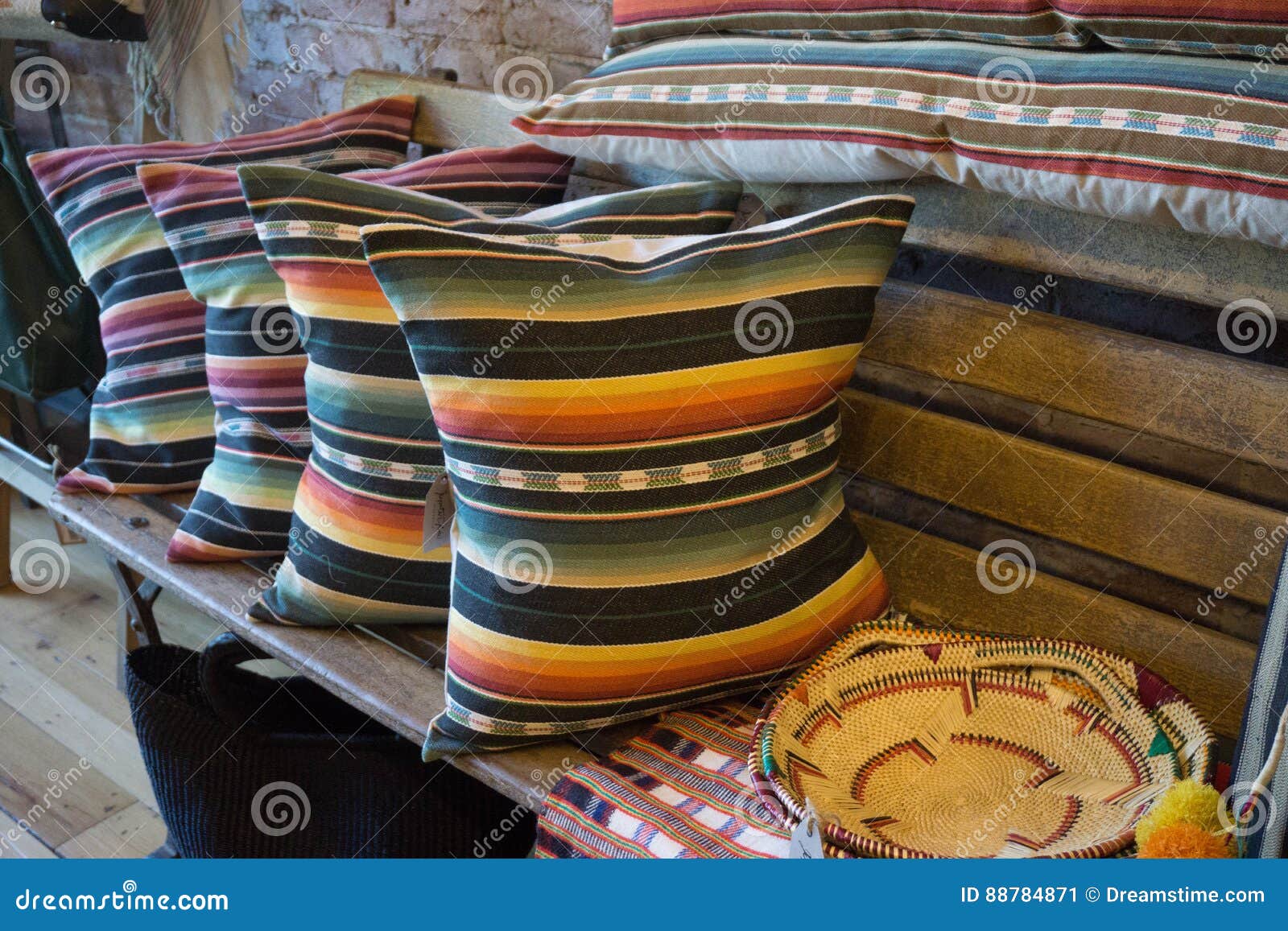 Colorful Throw Pillows on Bench Stock Image - Image of bench, woven ...