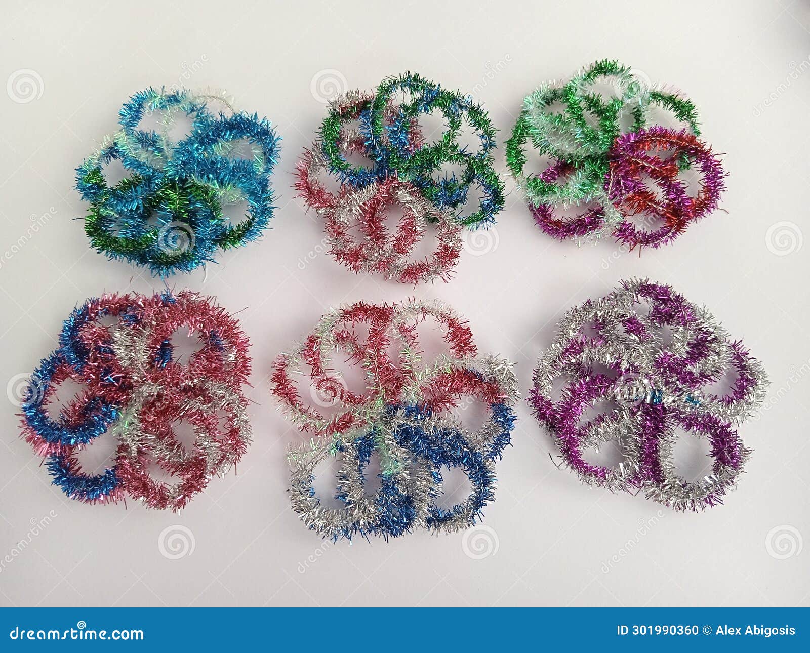 Colorful Tinsel Flower Shapes on a White Background Stock Photo - Image ...