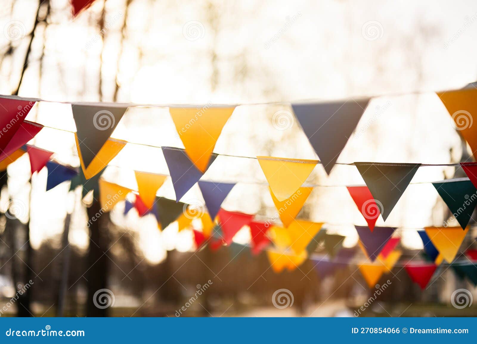 Colorful Triangular Flags Against Sunset Sky Stock Photo - Image of ...