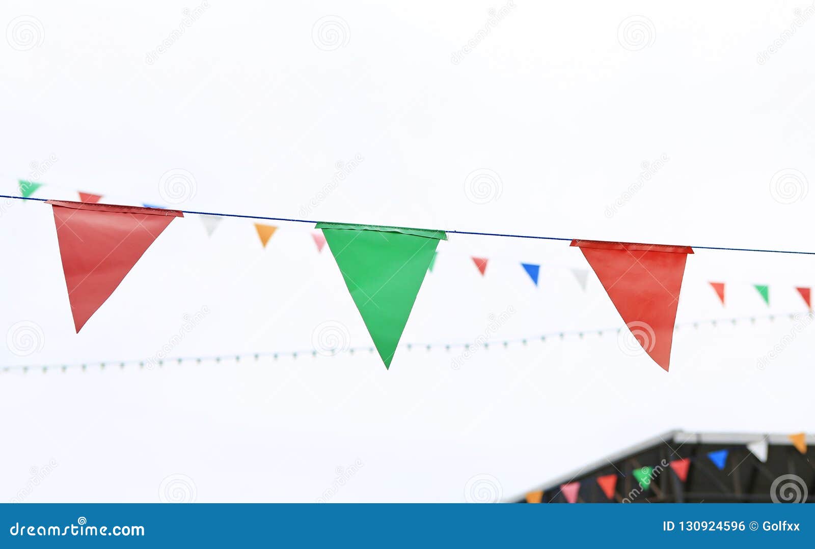 Colorful Triangular Flags Hanging in the White Sky Outdoor Stock Photo ...