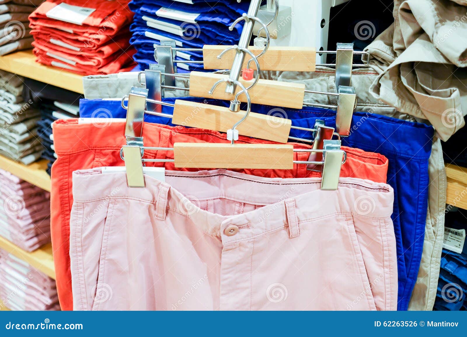 Colorful trousers on rack stock photo. Image of casual - 62263526