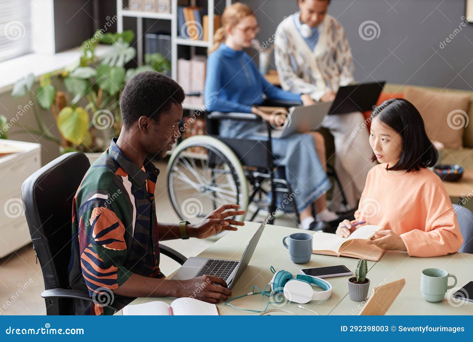 Colorful Two Young Professionals Collaborating on Project at Meeting ...