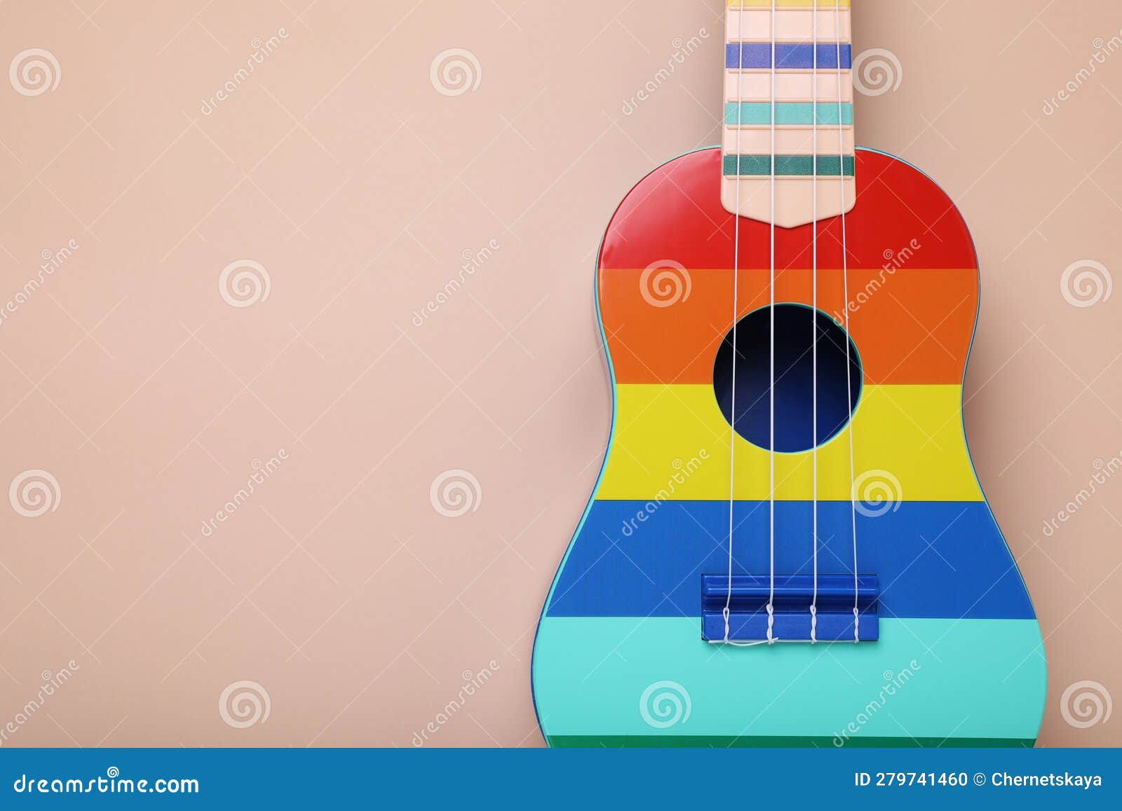 Colorful Ukulele on Beige Background, Top View and Space for Text ...