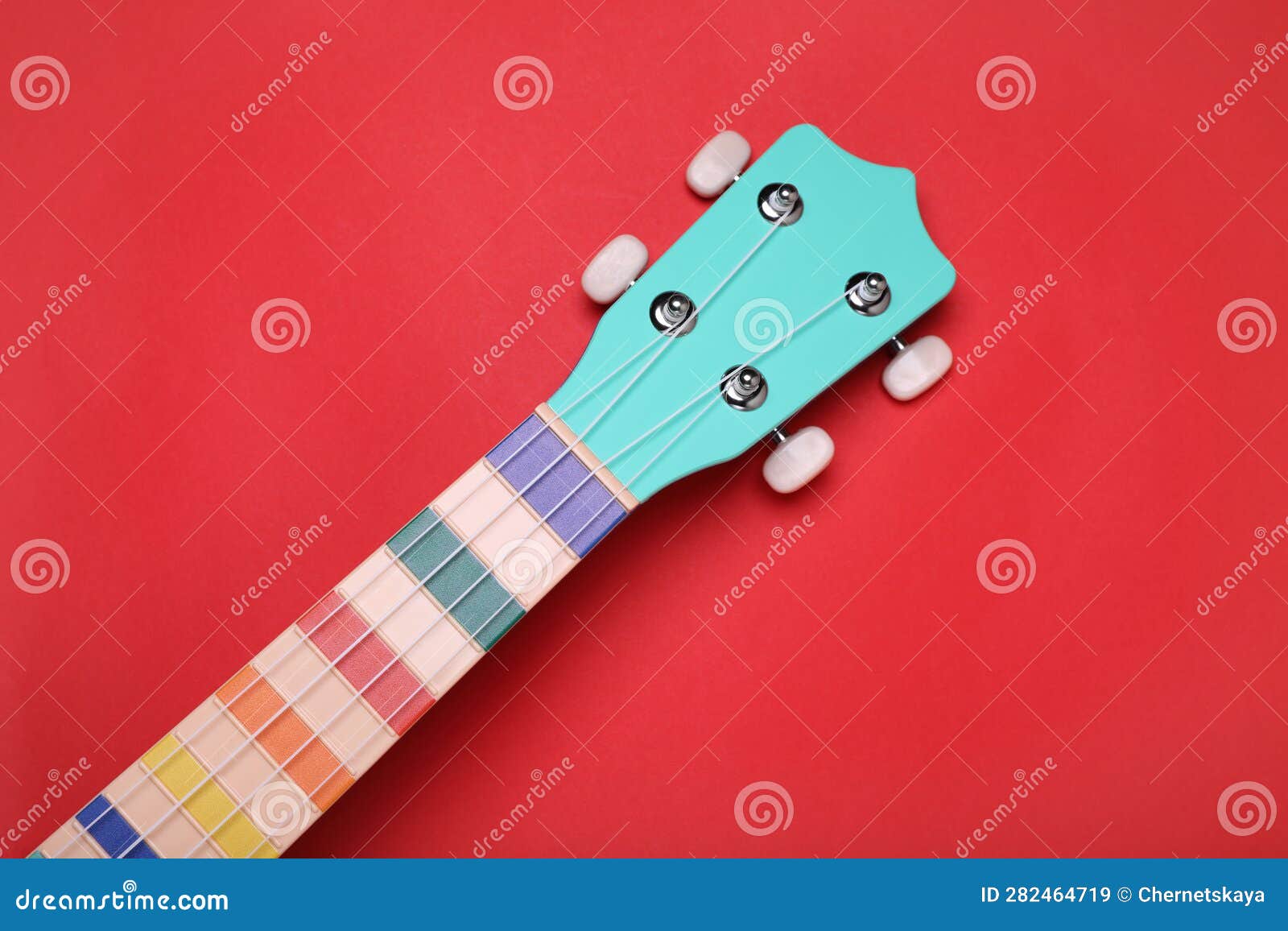 Colorful Ukulele Neck on Red Background, Top View. String Musical ...