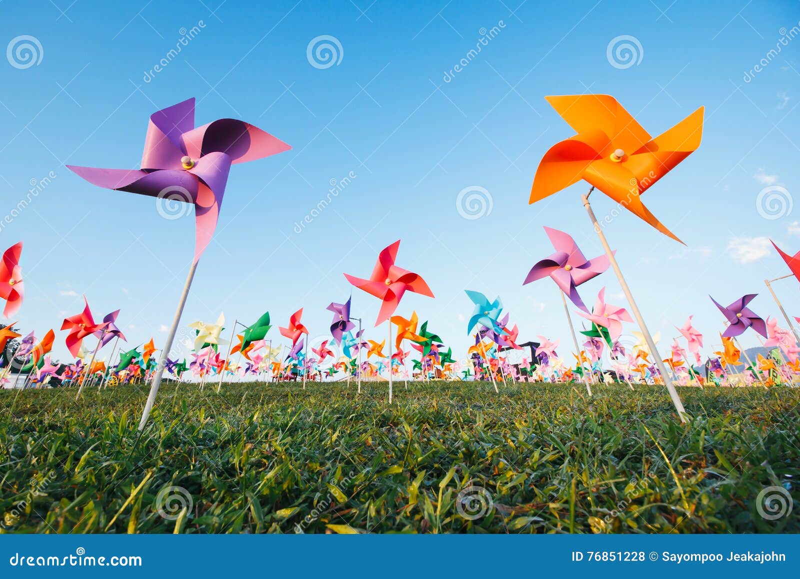 Colorful wind wheels stock photo. Image of mill, wheel - 76851228