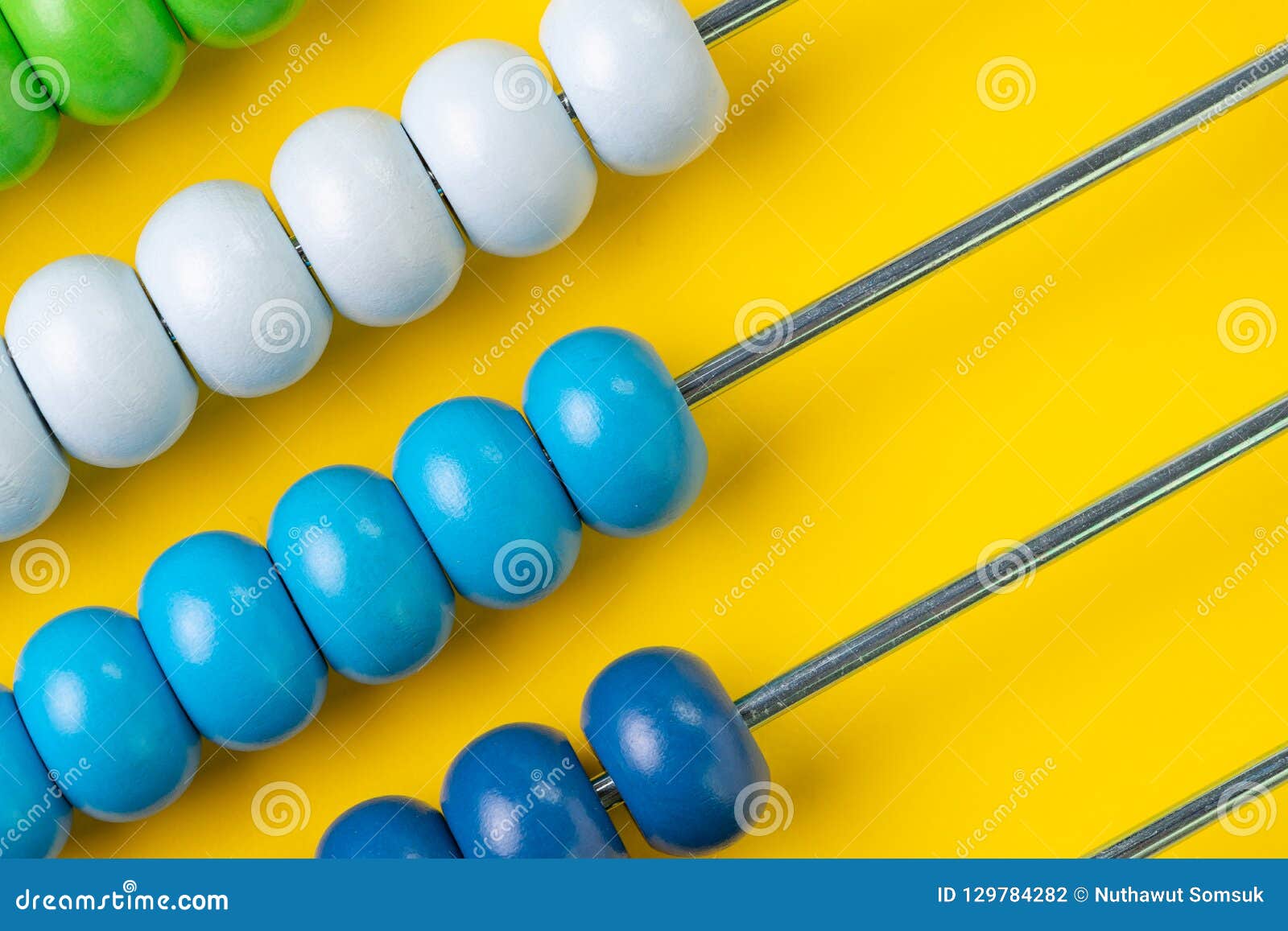 Colorful Wooden Abacus Beads on Yellow Background, Business Financial ... Colorful Wooden Abacus Beads on Yellow Background, Business Financial ...