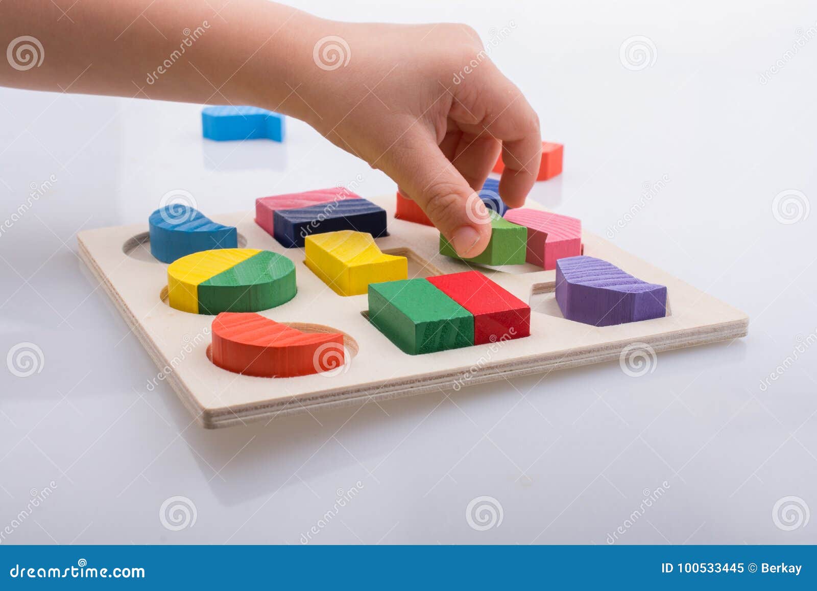 Colorful Pieces of a Logic Puzzle in Hand Stock Image - Image of ...