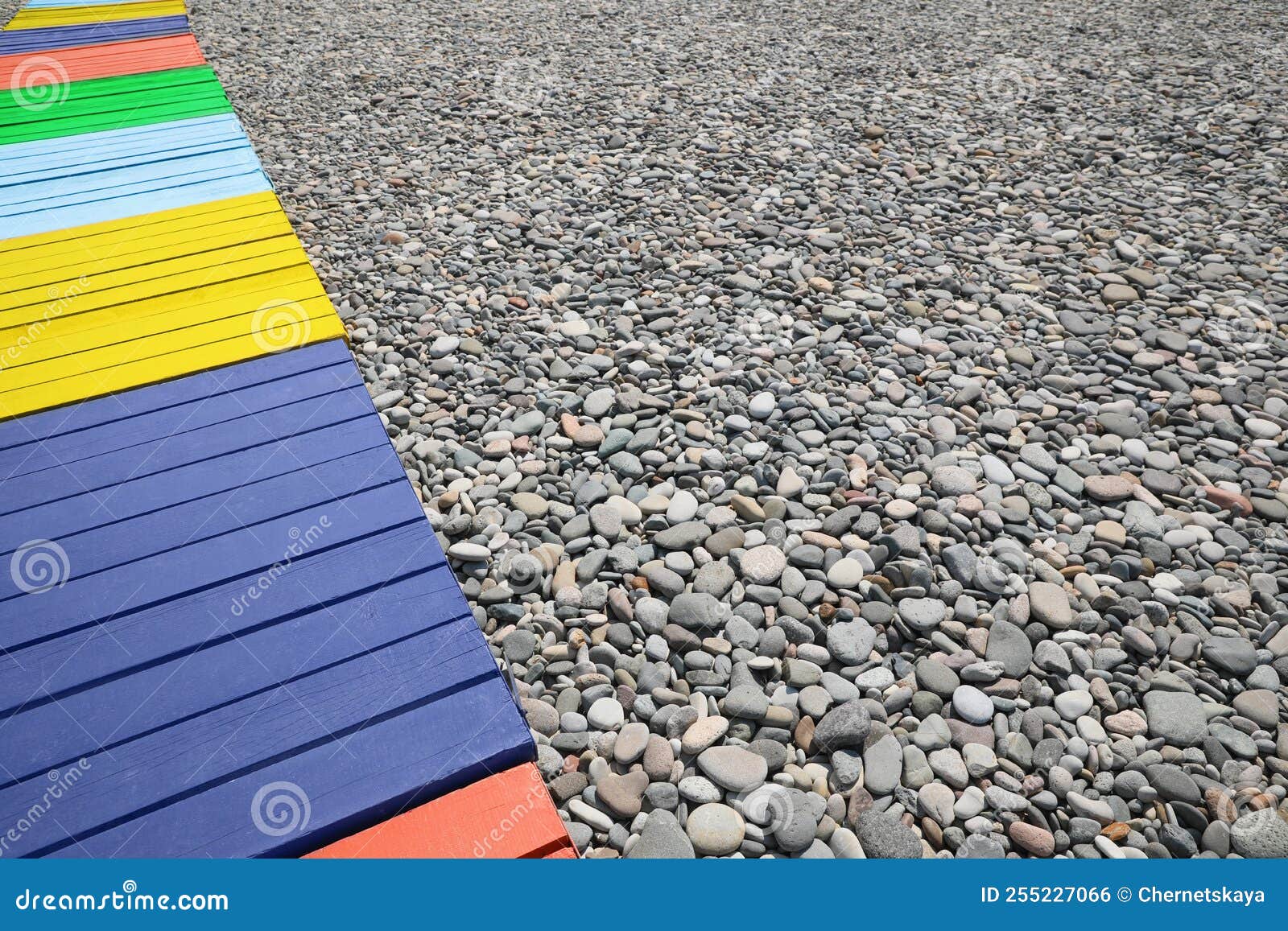 Colorful Wooden Walkway on Pebble Beach. Space for Text Stock Photo ...