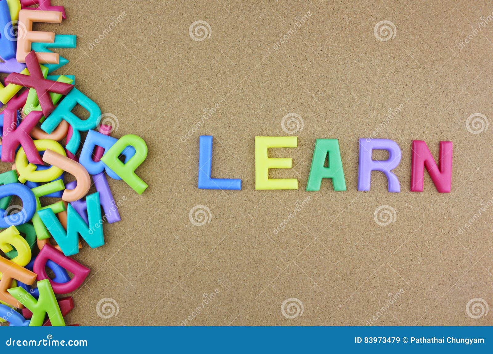 The Colorful Word `Learn` Over the Brown Board Surface Composition ...