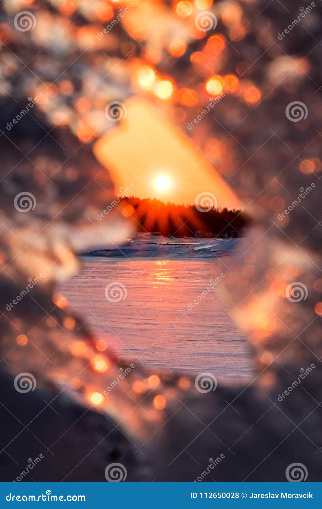 Sun rays through ice stock photo. Image of frozen, sunset - 112650028
