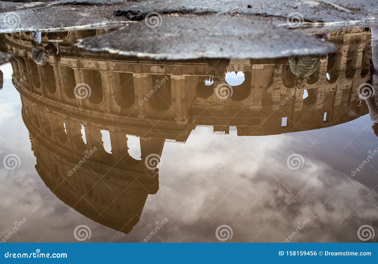 Colosseum Mirrored in a Puddle of Water. Stock Photo - Image of ...