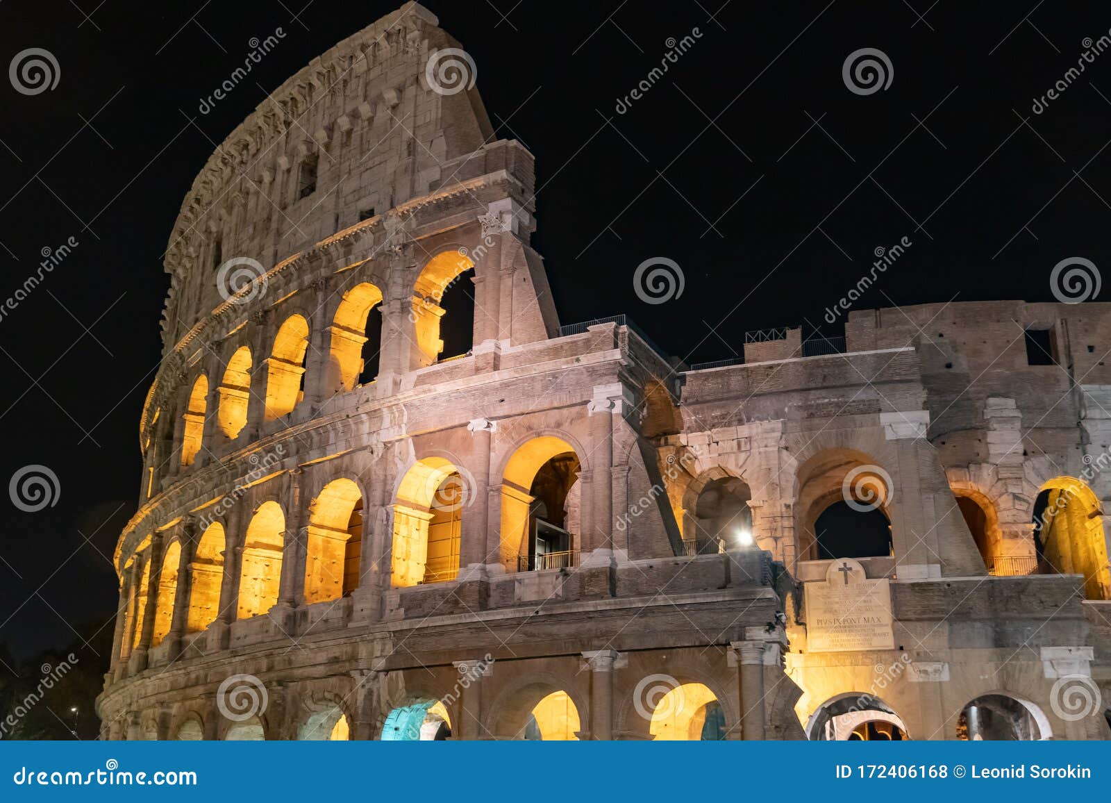 The Colosseum Under the Glow of Lights at Night Stock Photo - Image of ...