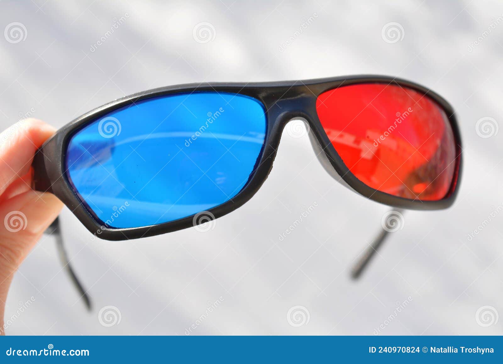 Colour Red and Blue Glasses in Hand White Background Stock Photo ...